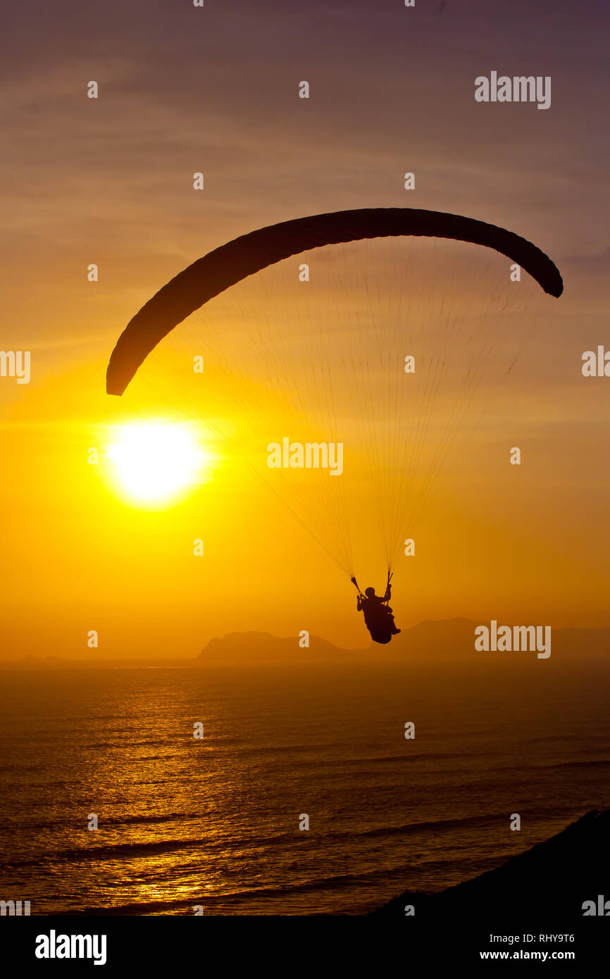 Parasuit ride in the sunset at Lima,Peru Stock Photo - Alamy