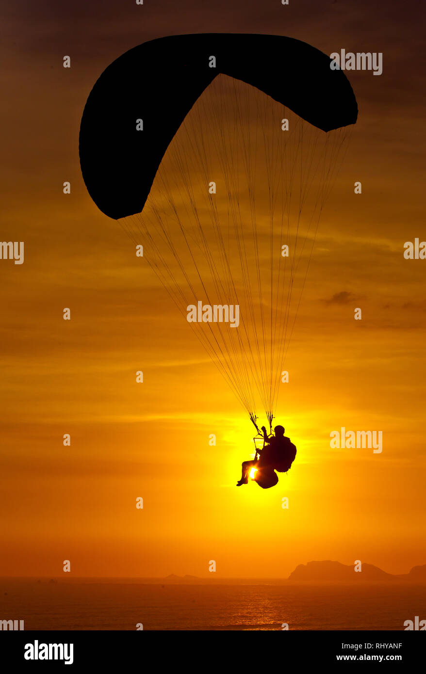 Parasuit ride in the sunset at Lima,Peru Stock Photo - Alamy