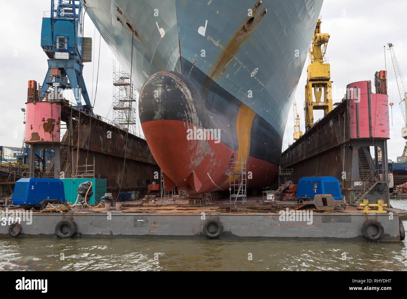 Large ship for repair at the shipyard Stock Photo - Alamy