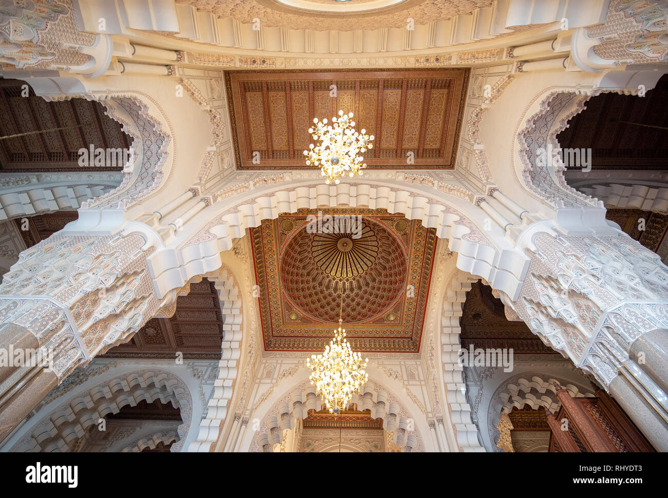 Inside Hassan II Mosque interior corridor with columns. Arabic arches ...