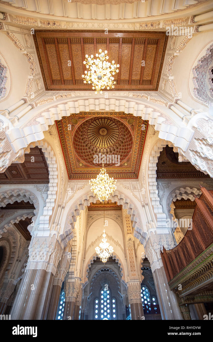 Inside Hassan II Mosque interior corridor with columns. Arabic arches ...