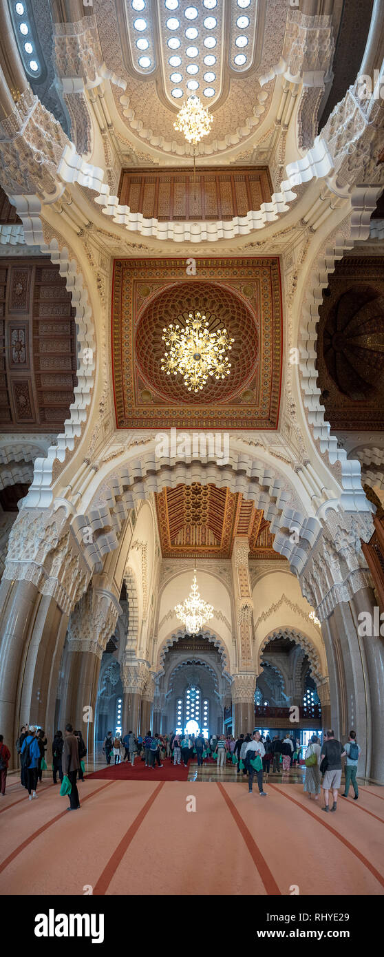 Inside Hassan II Mosque interior corridor with columns. Arabic arches ...
