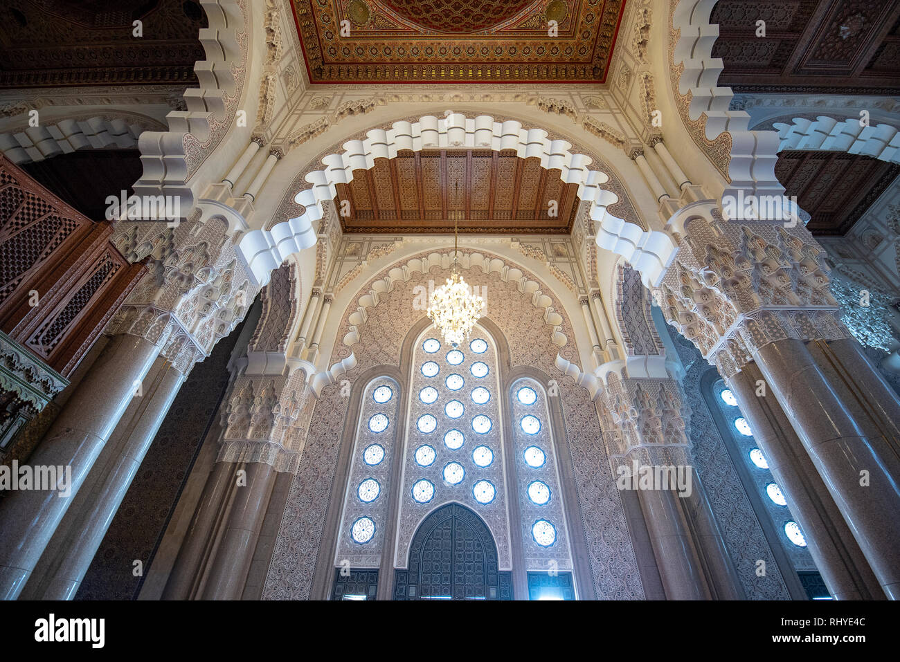 Inside Hassan II Mosque interior corridor with columns. Arabic arches ...
