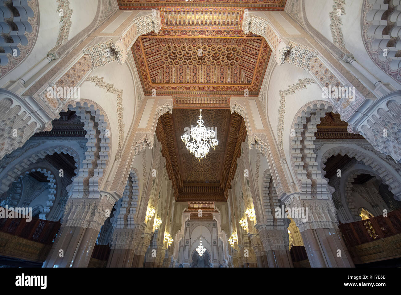 Inside Hassan II Mosque interior corridor with columns. Arabic arches ...