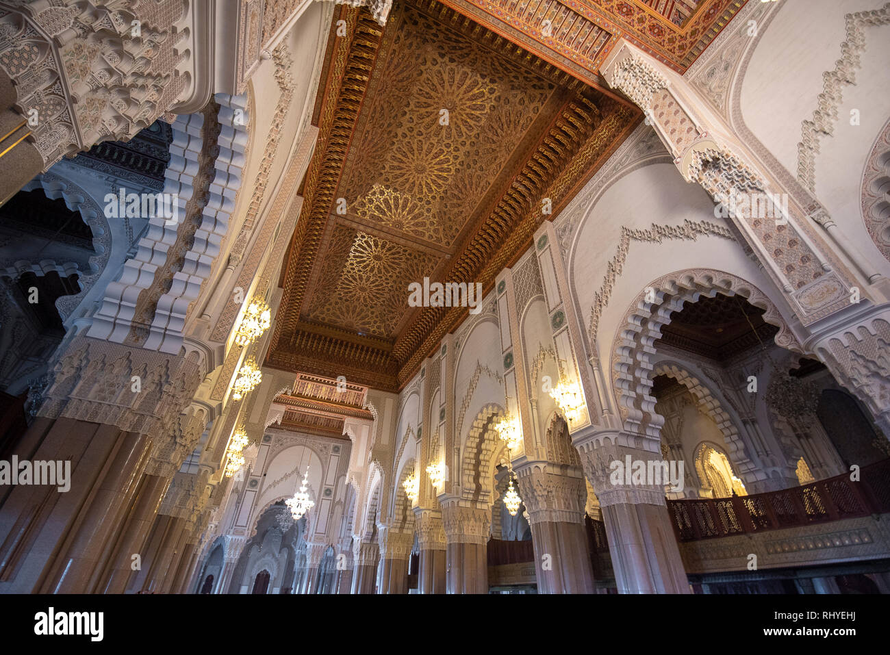 Inside Hassan II Mosque interior corridor with columns. Arabic arches ...