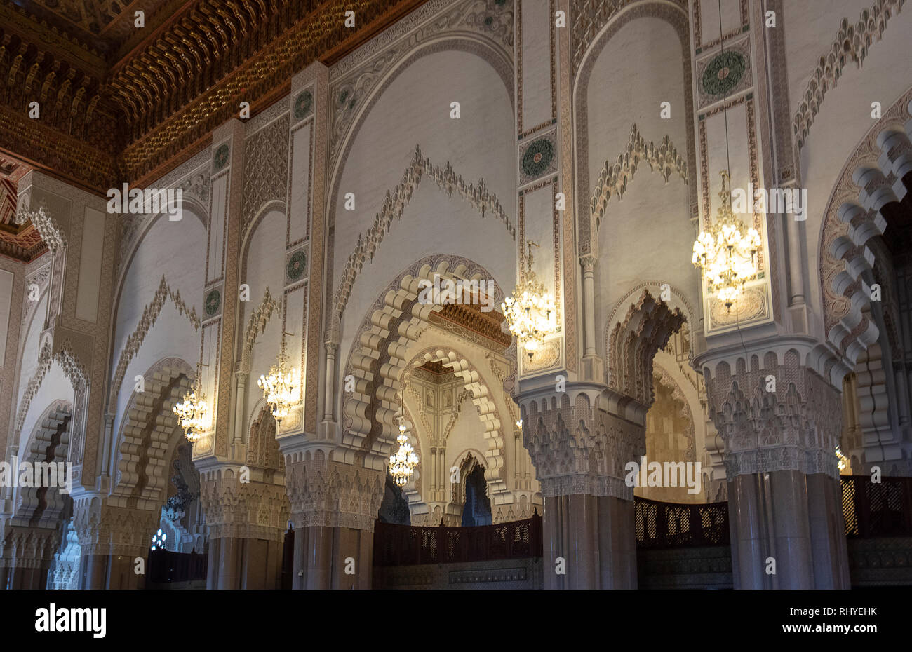 Inside Hassan II Mosque interior corridor with columns. Arabic arches ...