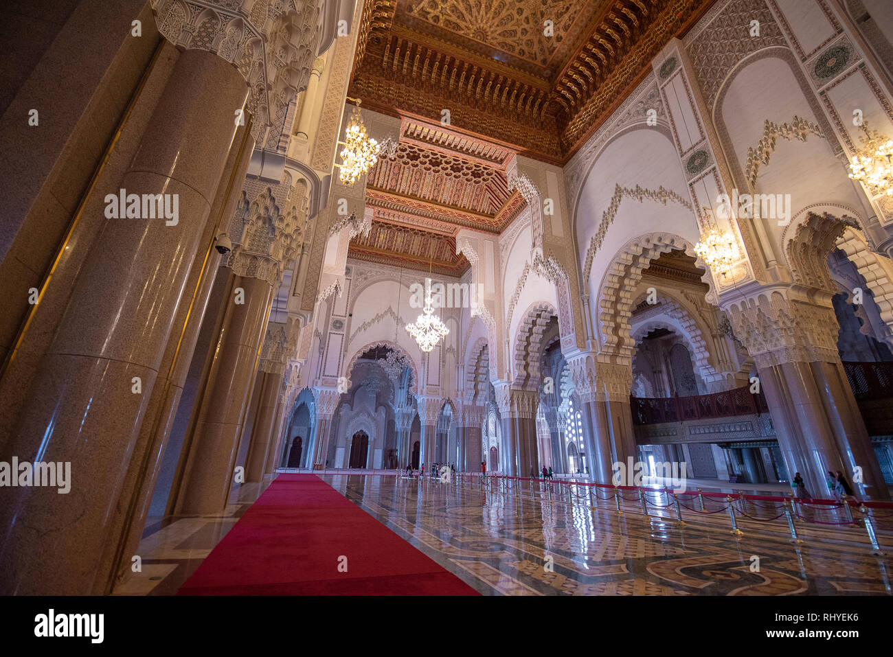 Inside Hassan II Mosque interior corridor with columns. Arabic arches ...