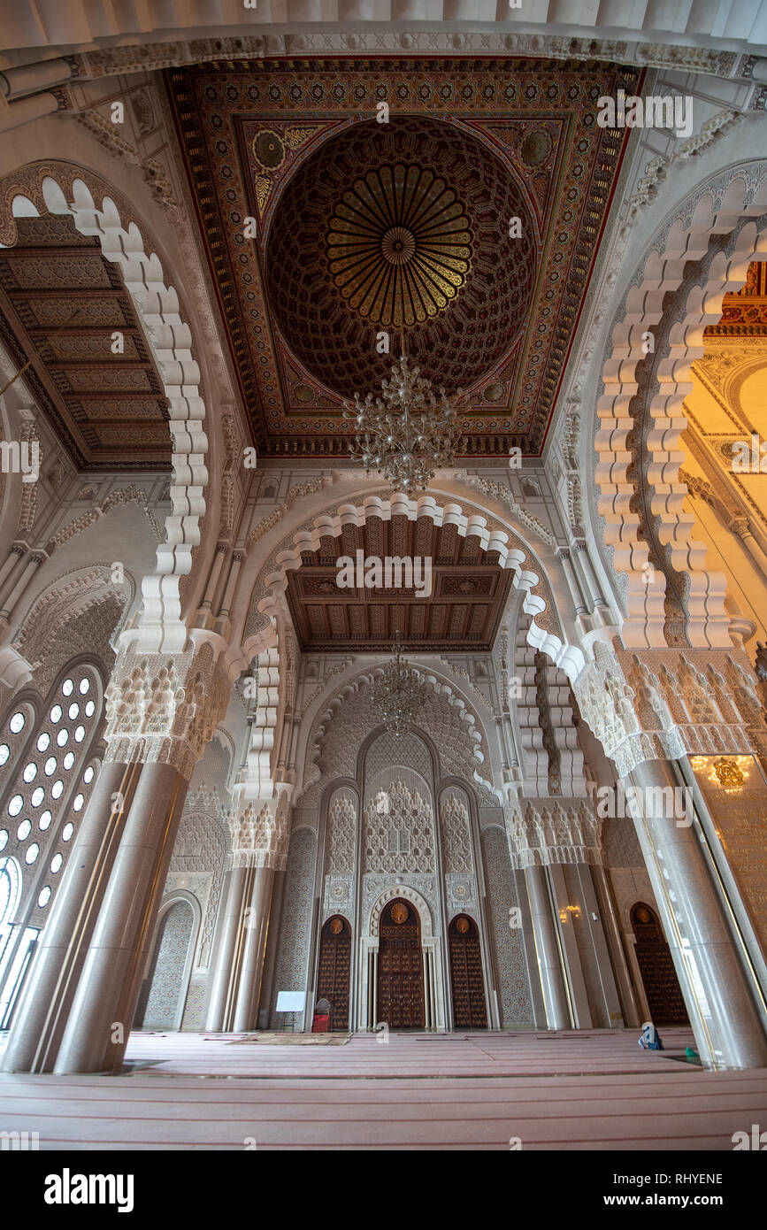Inside Hassan II Mosque interior corridor with columns. Arabic arches ...
