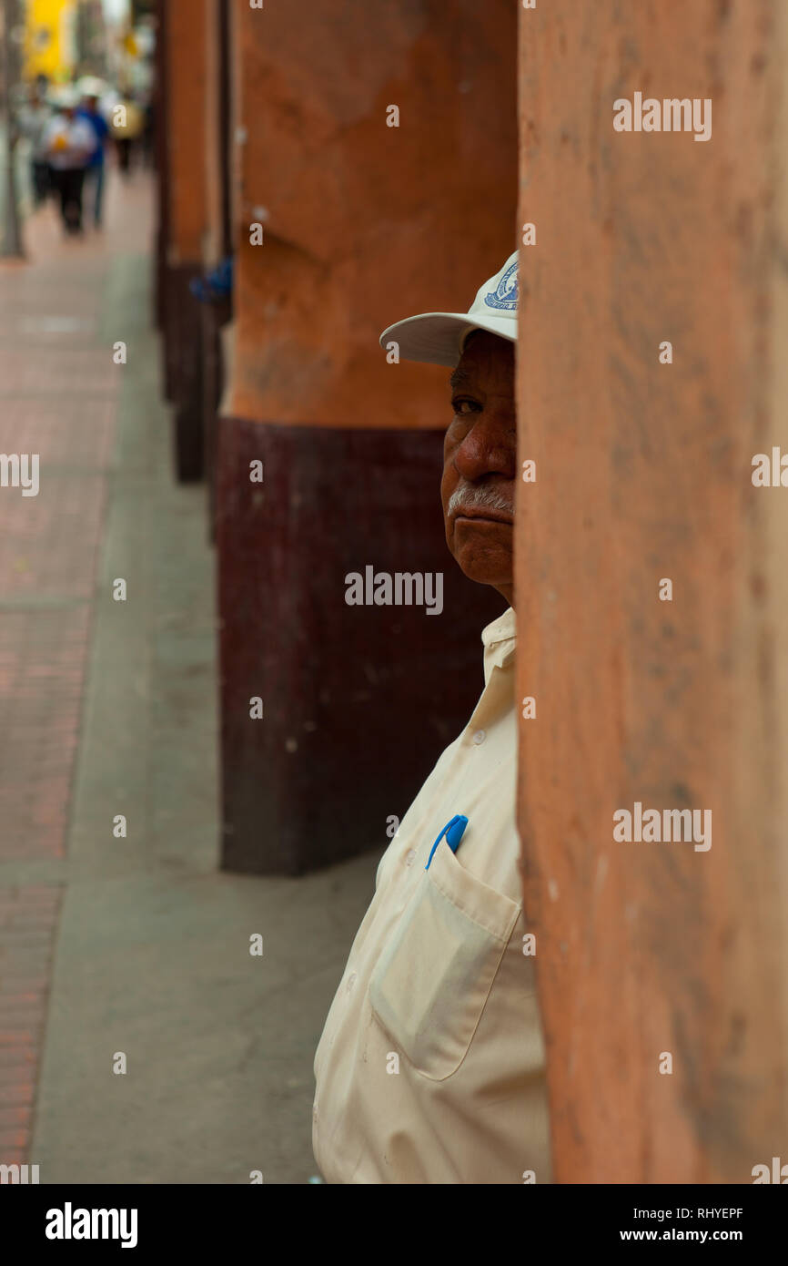 Old man overlooking at the streets of Lima Stock Photo - Alamy