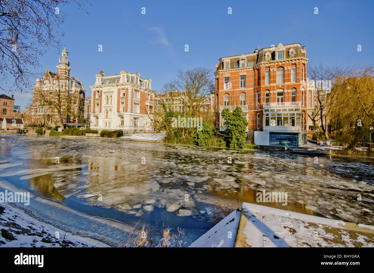 Frozen canal in Amsterdam, The Netherlands Stock Photo - Alamy