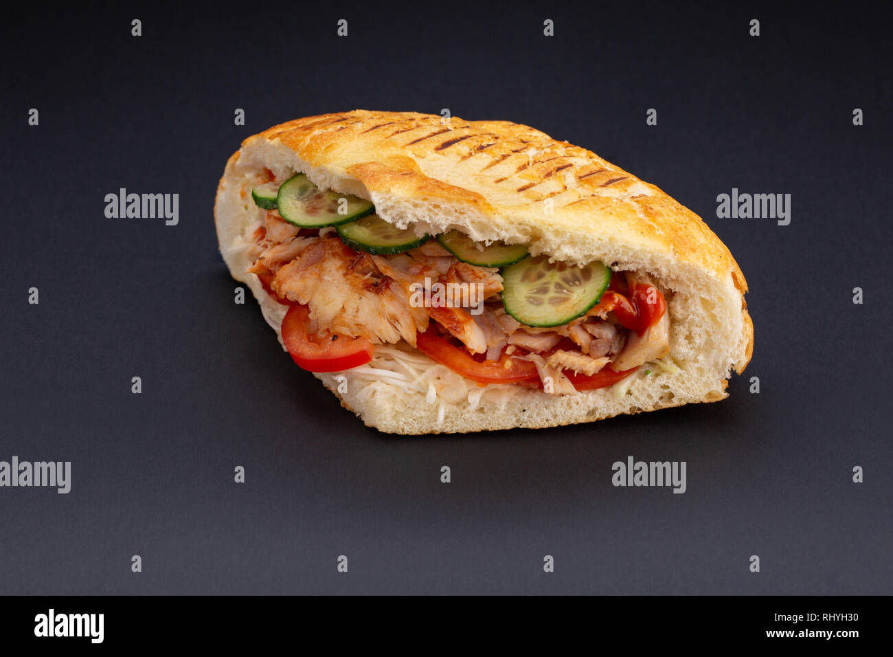 Close up of doner kebab with chicken on black background Stock Photo ...