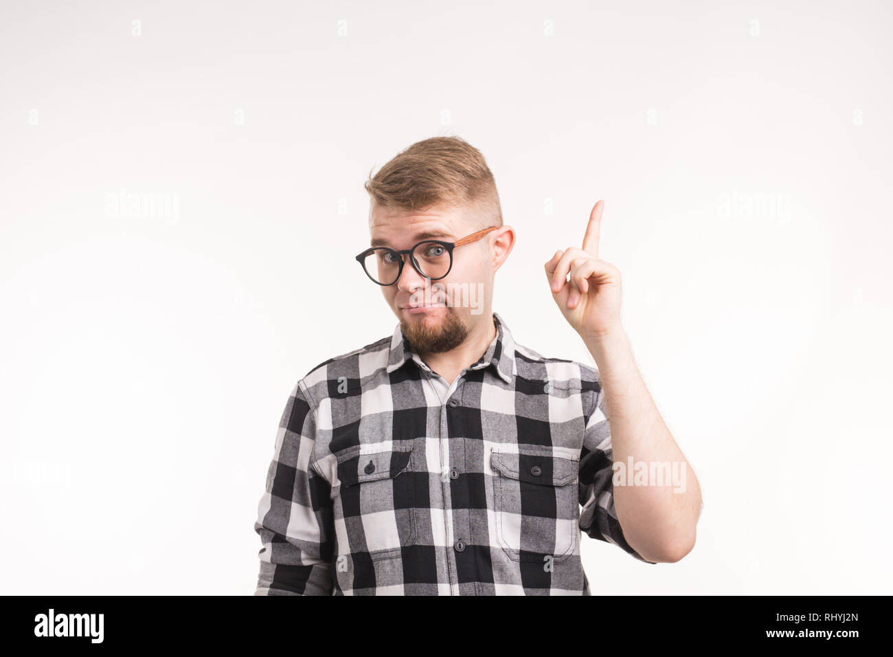 Geek, nerd and education concept - Handsome man in plaid shirt finger ...