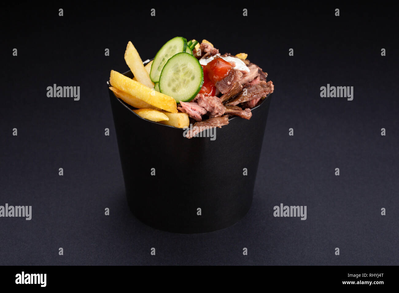 Freshly cooked shawarma plate with beef, french fries, vegetables and ...