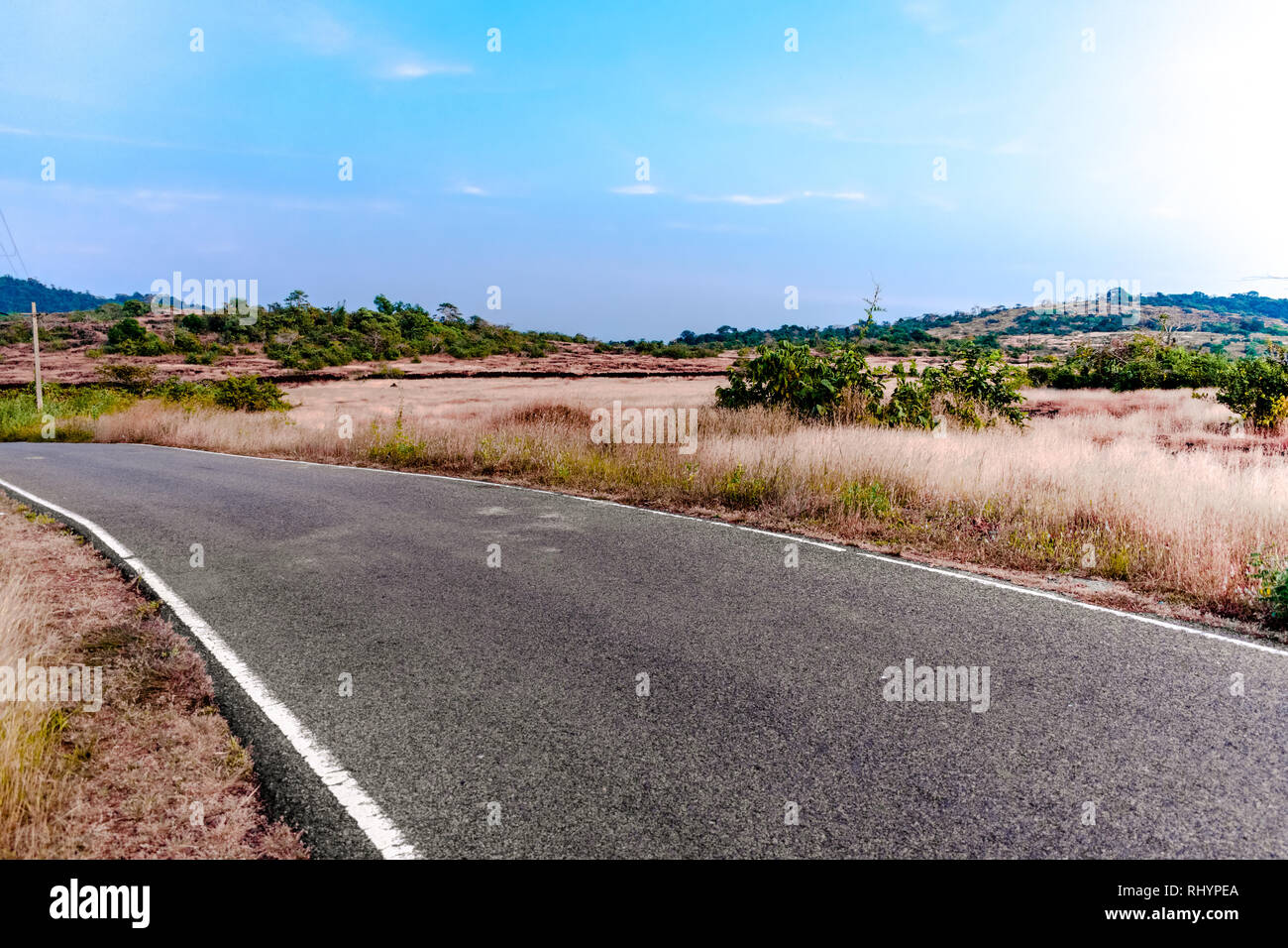 Beautiful photo of a single lane road amidst the barren lands of desert ...