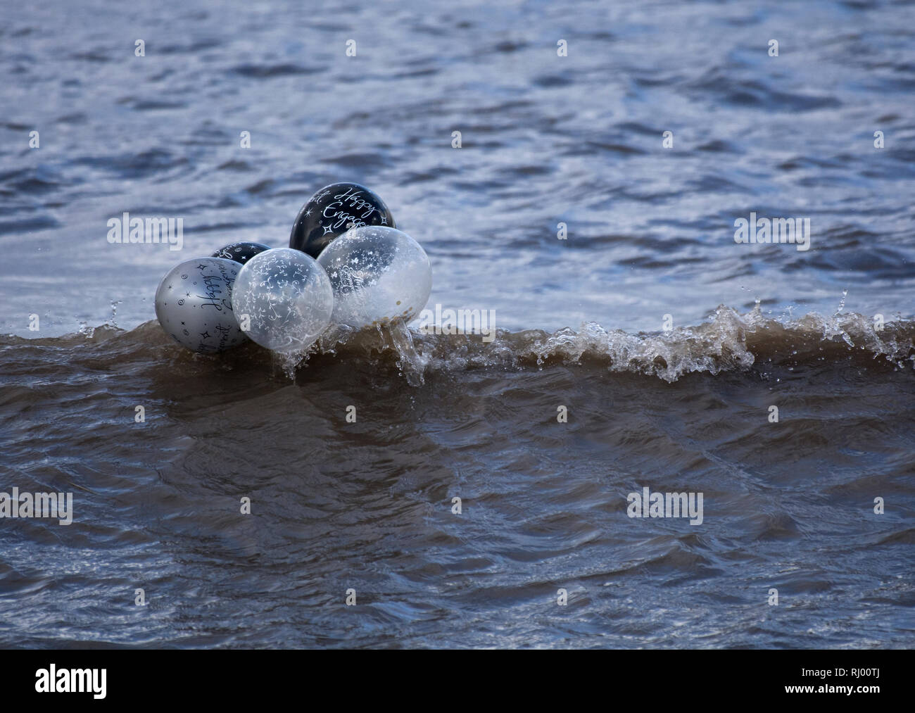Balloons floating away hi-res stock photography and images - Alamy