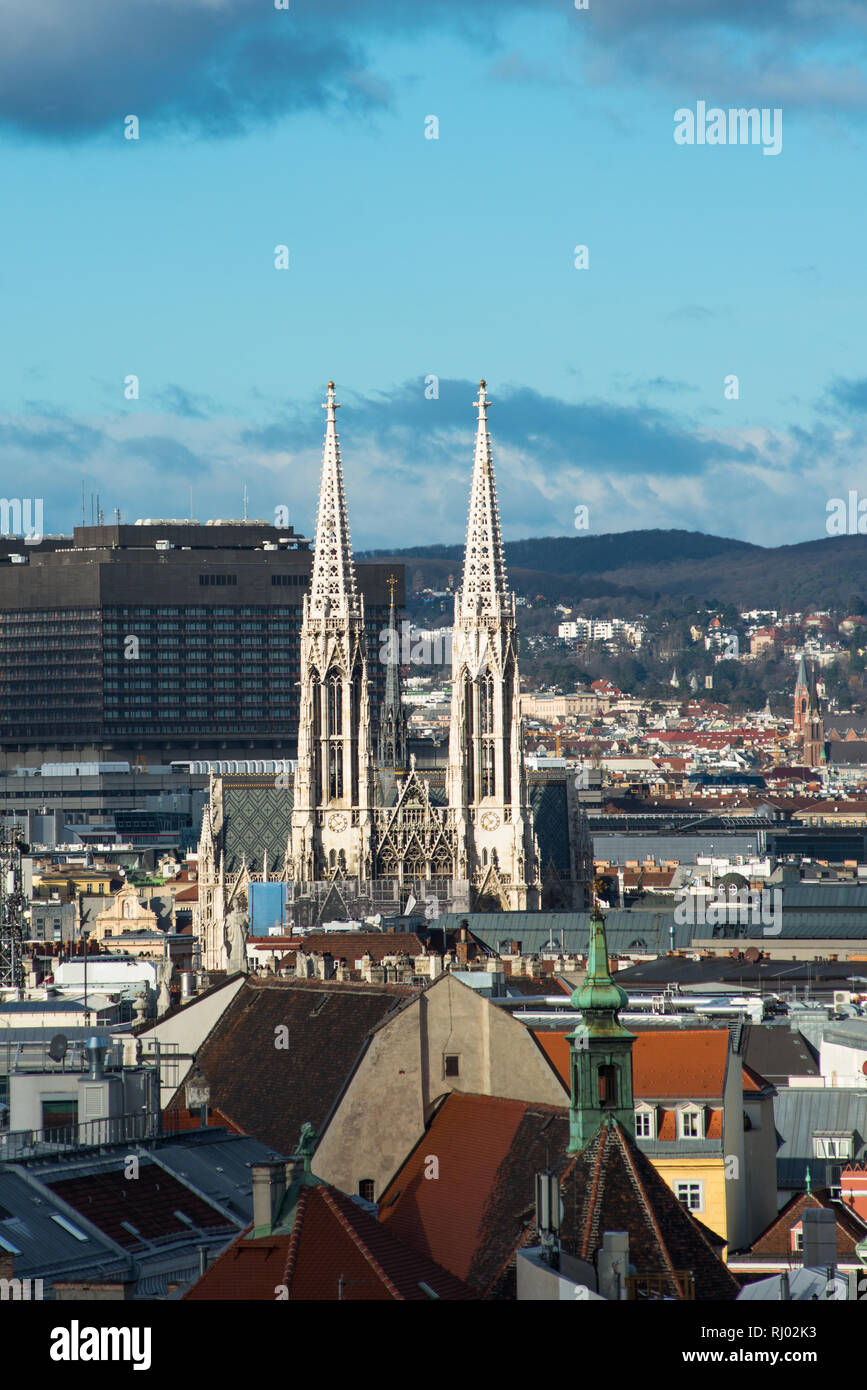 Vienna city skyline with the twin spires of the Votive Church seen from ...