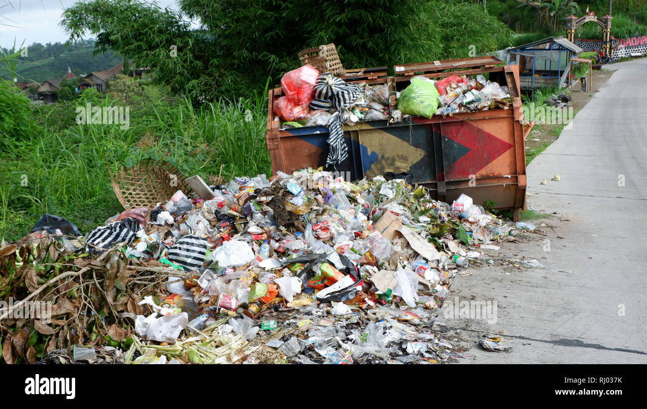 a pile of garbage on the roadside Stock Photo - Alamy
