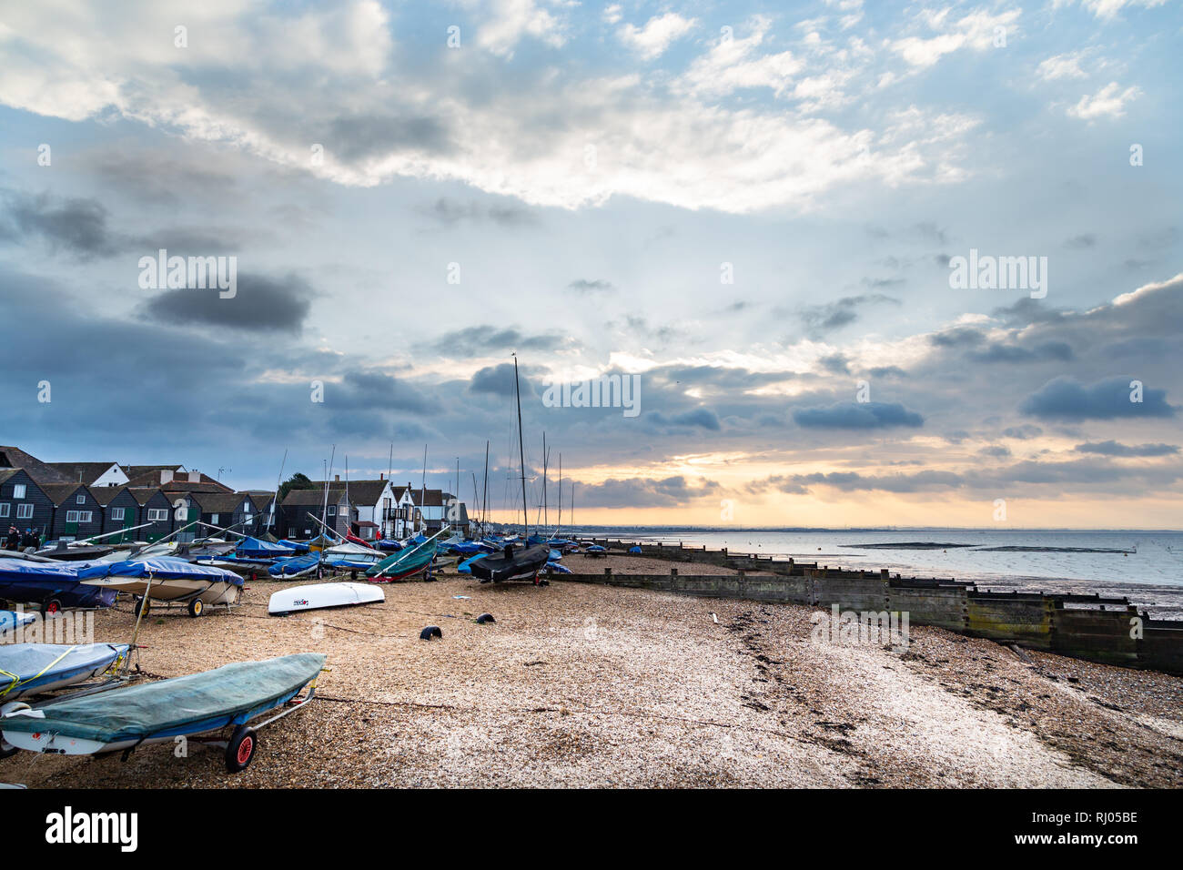 Boats on the beach in Whitstable, Kent, England Stock Photo - Alamy
