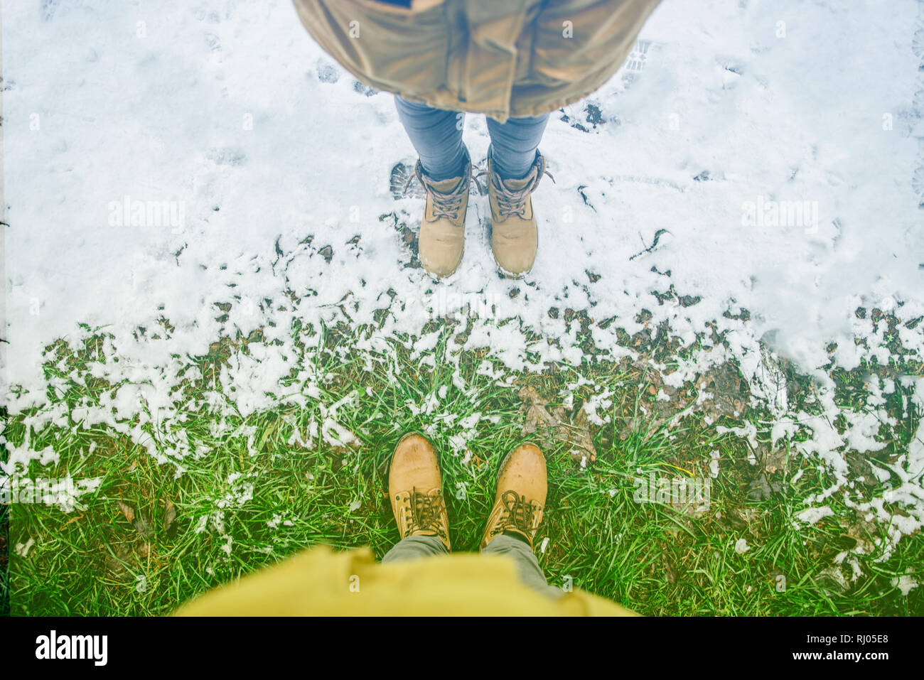 man stand in place where winter meet spring Stock Photo - Alamy