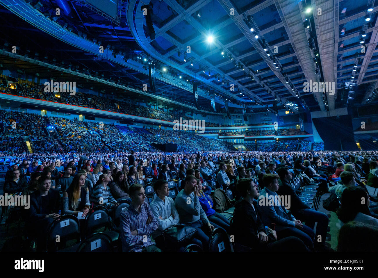 People attend business conference in congress hall at Synergy Global ...