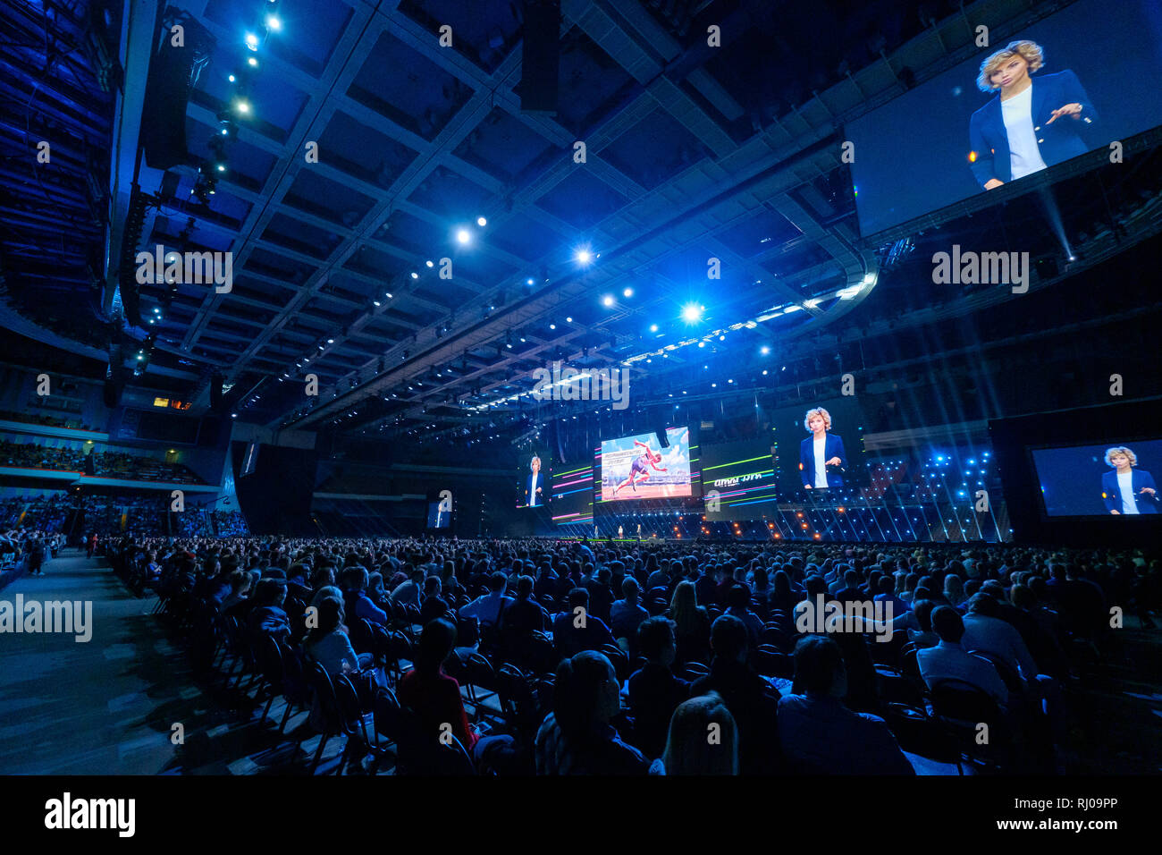 People attend business conference in congress hall at Synergy Global ...