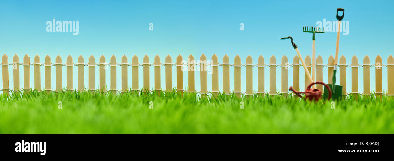 Gardening header background with tool on a fence from the garden Stock ...
