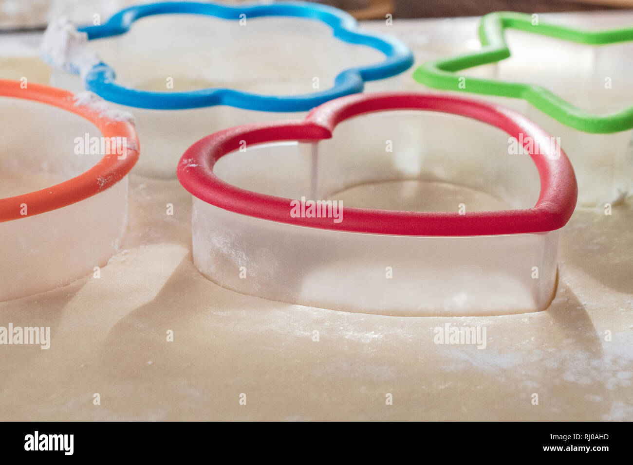 Close up view of a group of cookie cutters: heart, star, flower, and ...