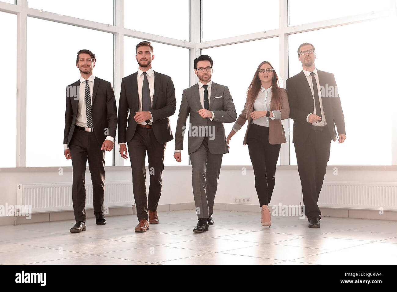 business team, walking at modern office interior Stock Photo - Alamy