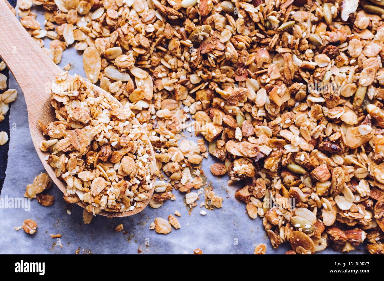 Homemade roasted granola on baking sheet with sesame, pumpkin ...
