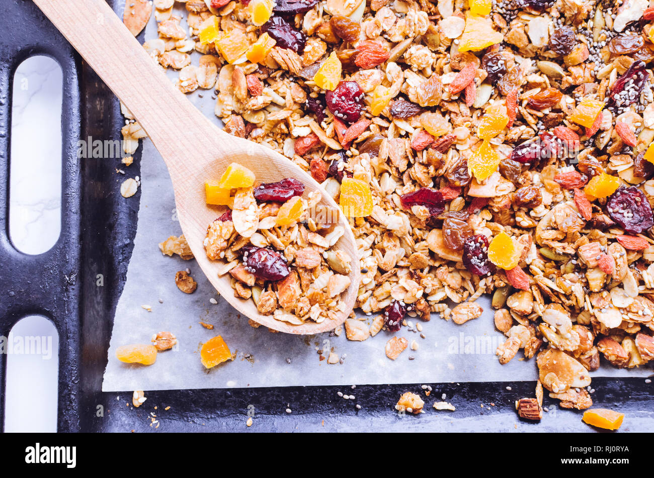 Homemade roasted granola on baking sheet with sesame, pumpkin ...