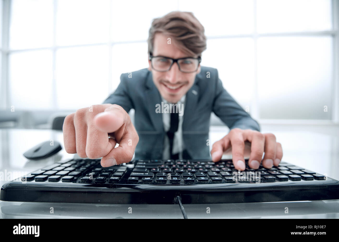man pointing at something with finger and using computer keyboard Stock ...