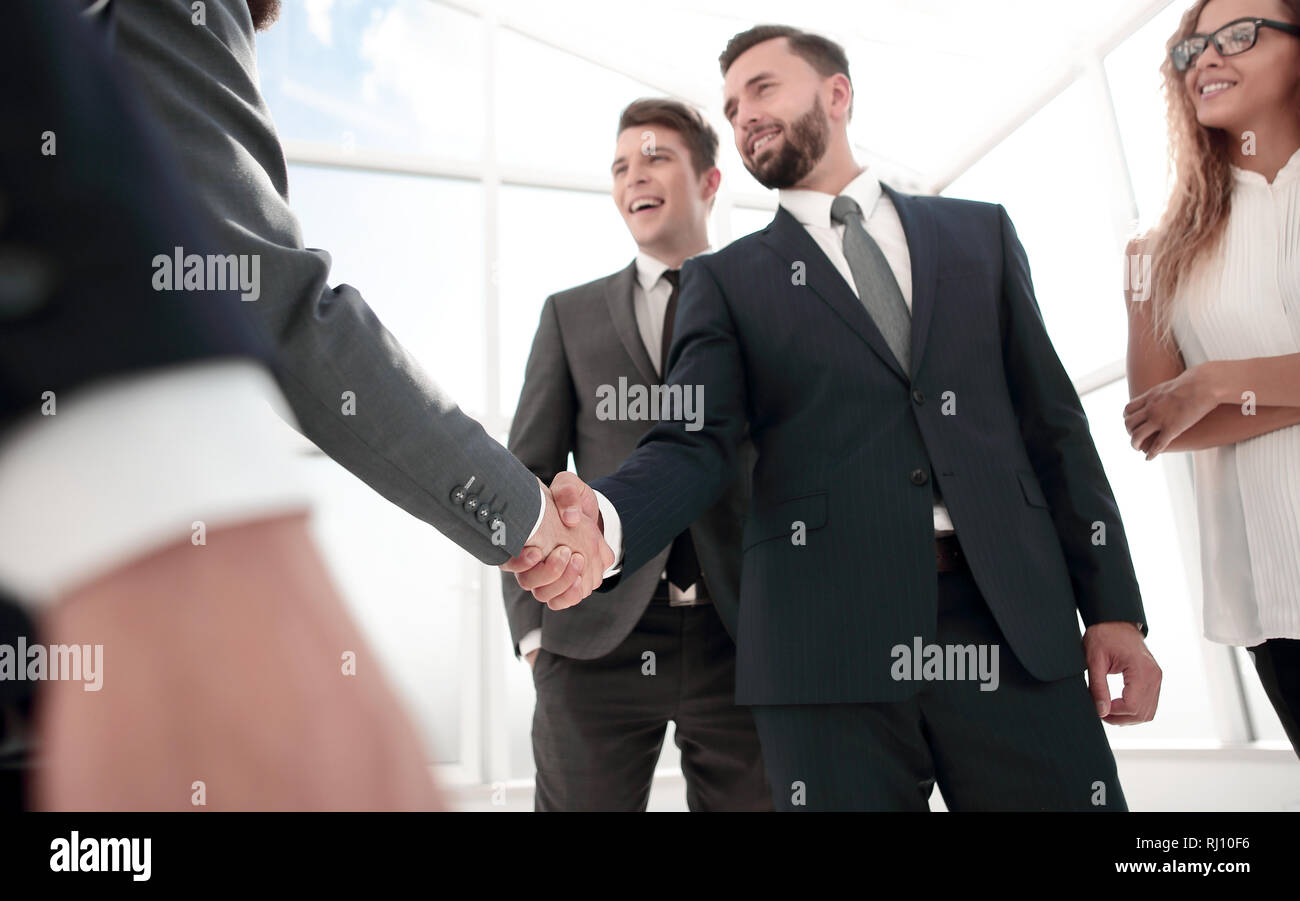 business partners confirming the transaction with their handshake Stock ...