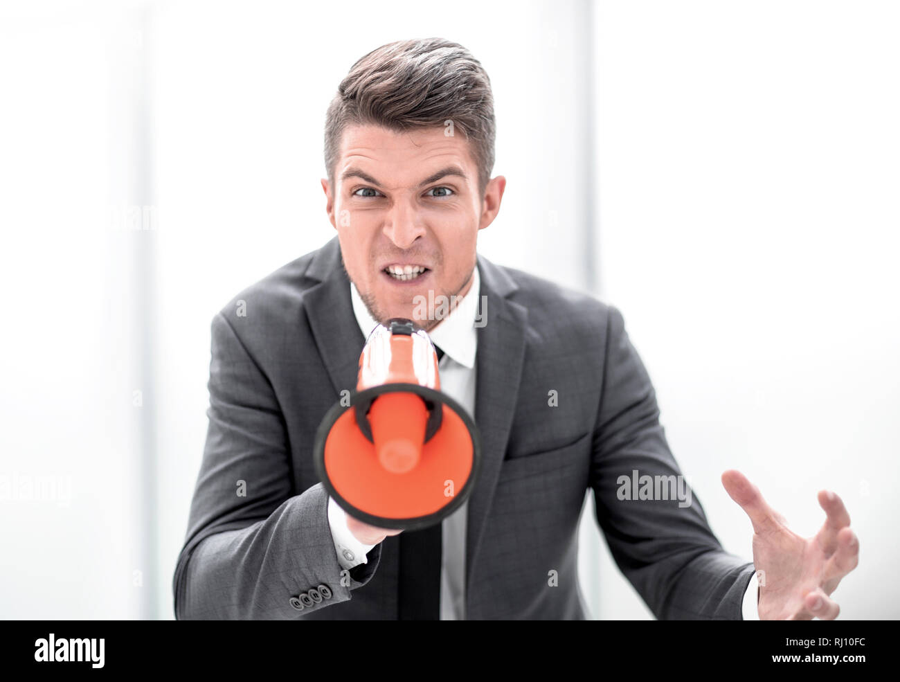 portrait of young man handsome shouting using megaphone Stock Photo - Alamy