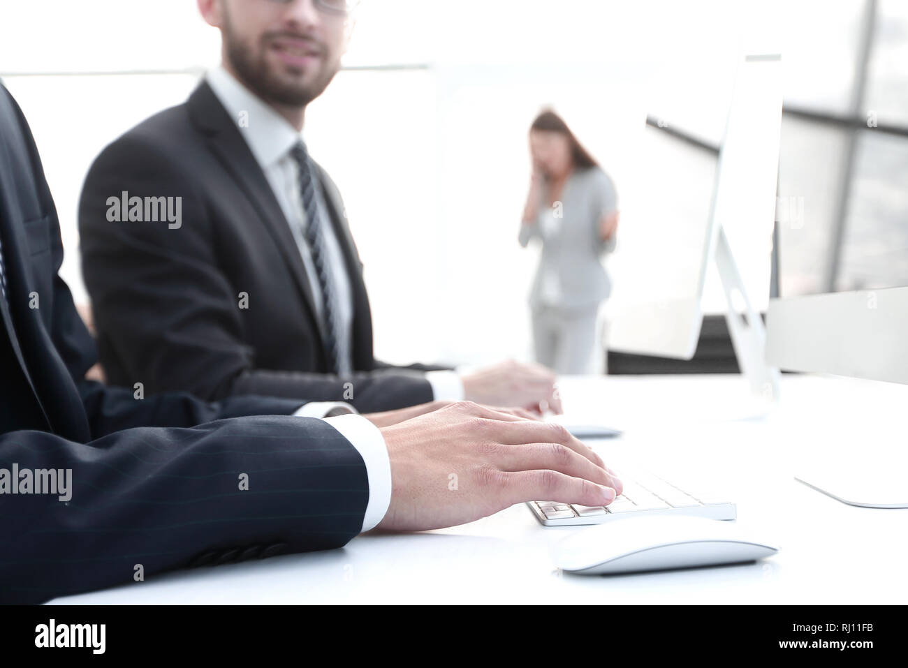 employees working on computers Stock Photo - Alamy