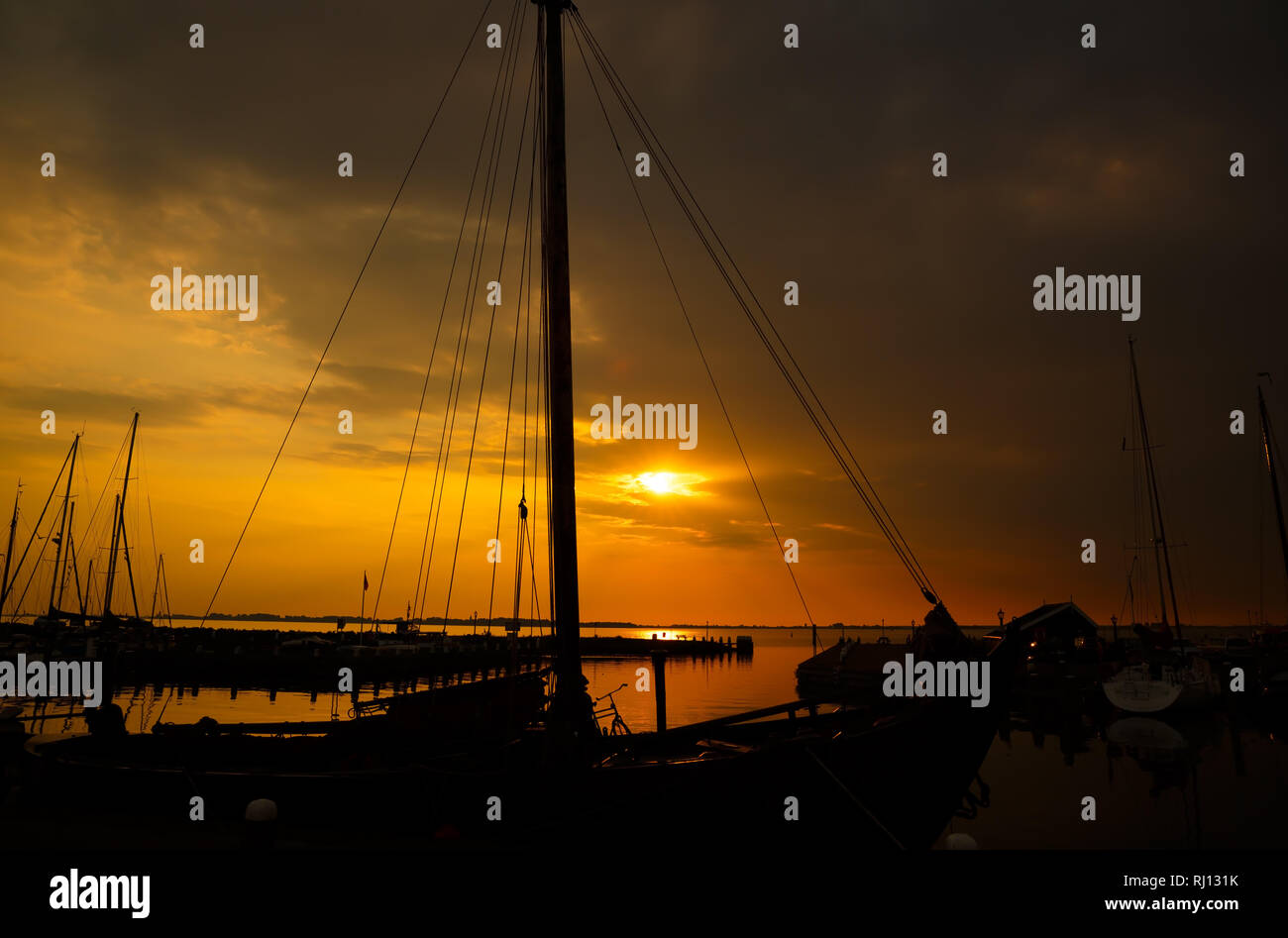 The boats at the sea harbour in the Dutch fisherman village Marken at ...