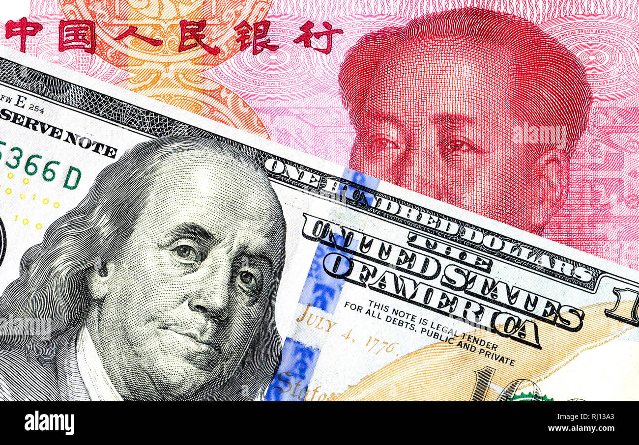 Chinese yuan banknote and american dollar for trade war and economic ...