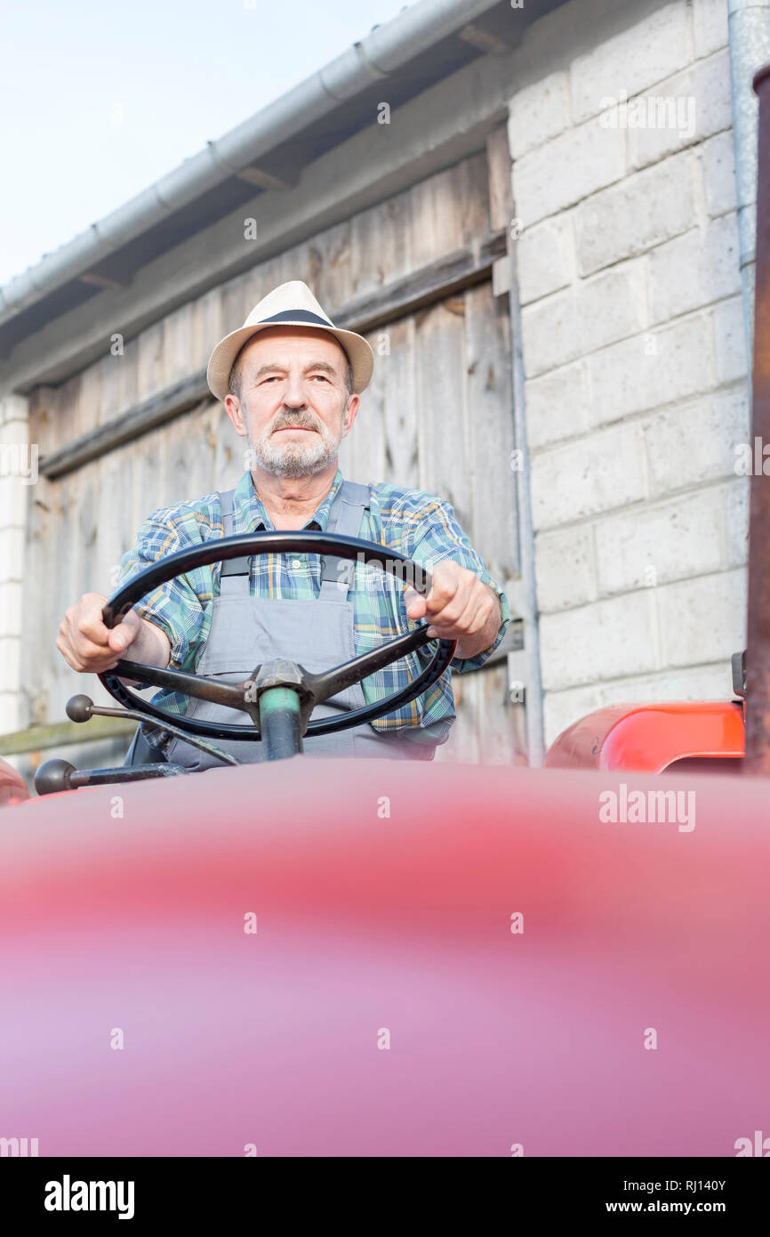 Farmer driving tractor hi-res stock photography and images - Alamy
