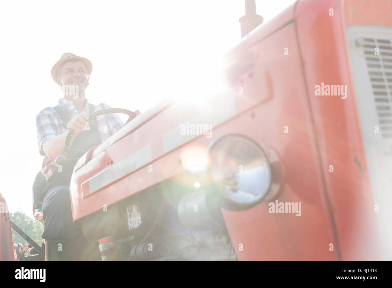 Farmer driving tractor hi-res stock photography and images - Alamy