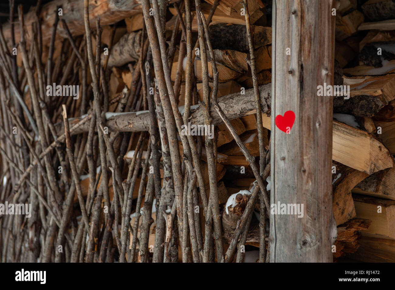Stack of natural wood, with red heart Stock Photo - Alamy