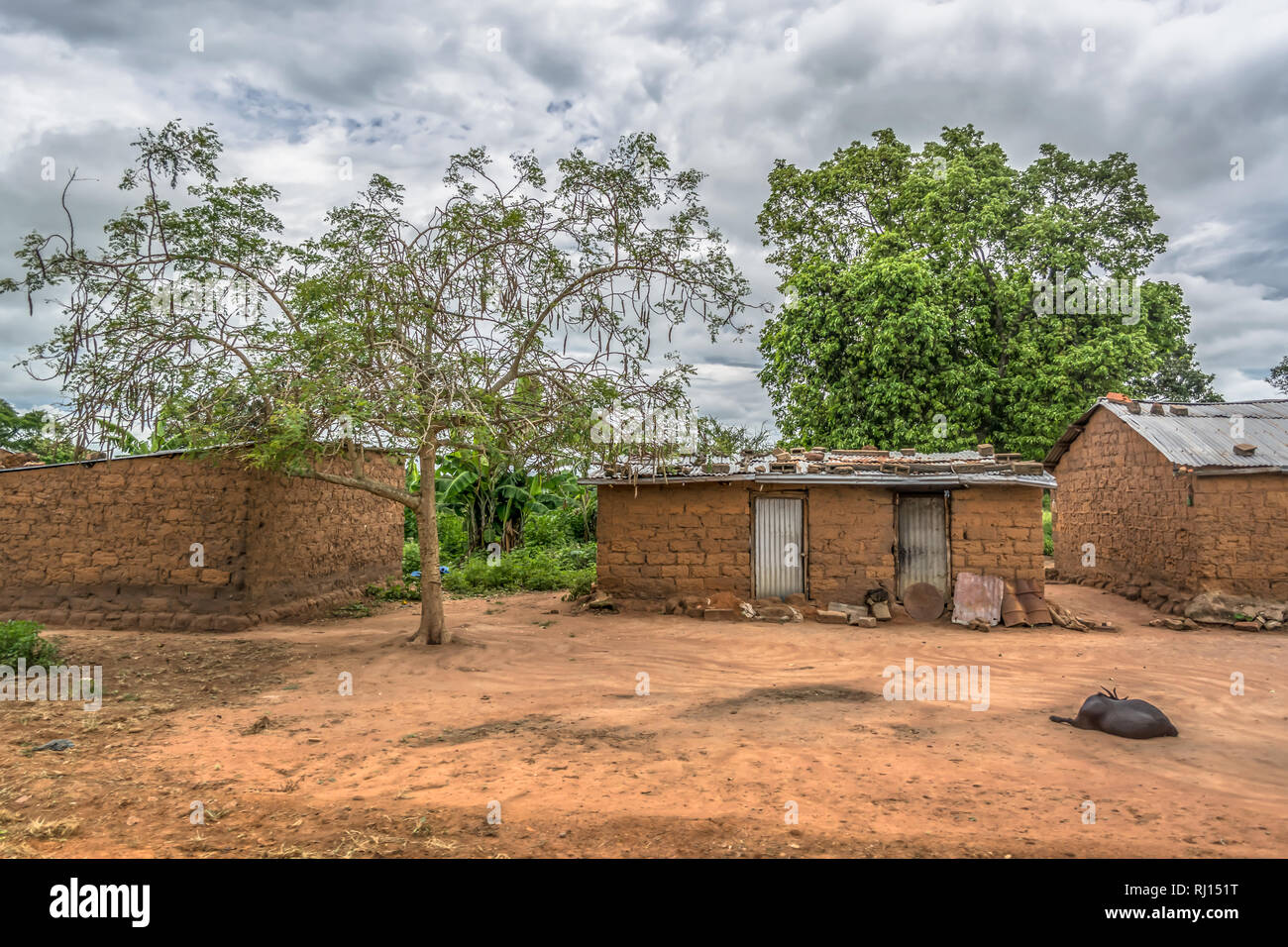 View of traditional village, a coat resting outdoor and zinc sheet on ...