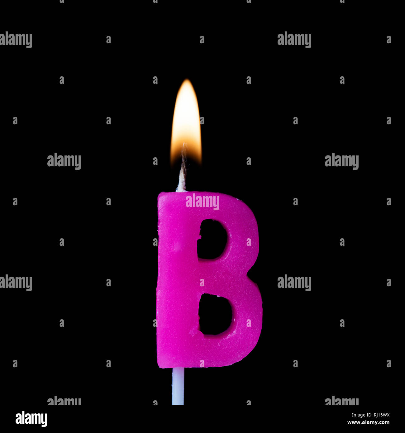 Letter B celebration birthday candle against a black background Stock ...
