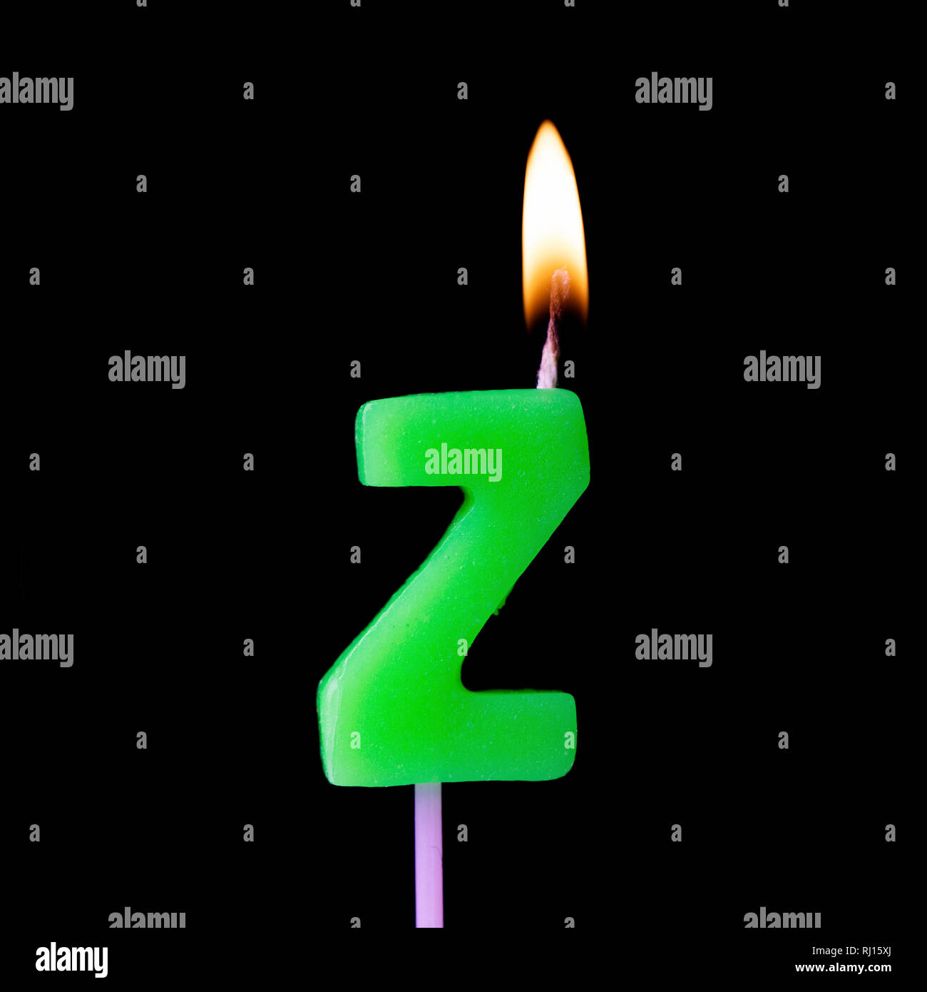 Letter Z celebration birthday candle against a black background Stock ...
