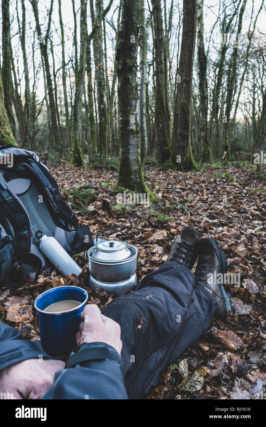 A man sitting in the woods Stock Photo - Alamy