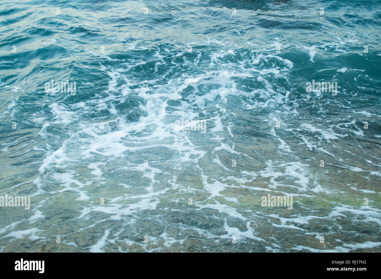 Abstract blue background of frothy sea surface Stock Photo - Alamy