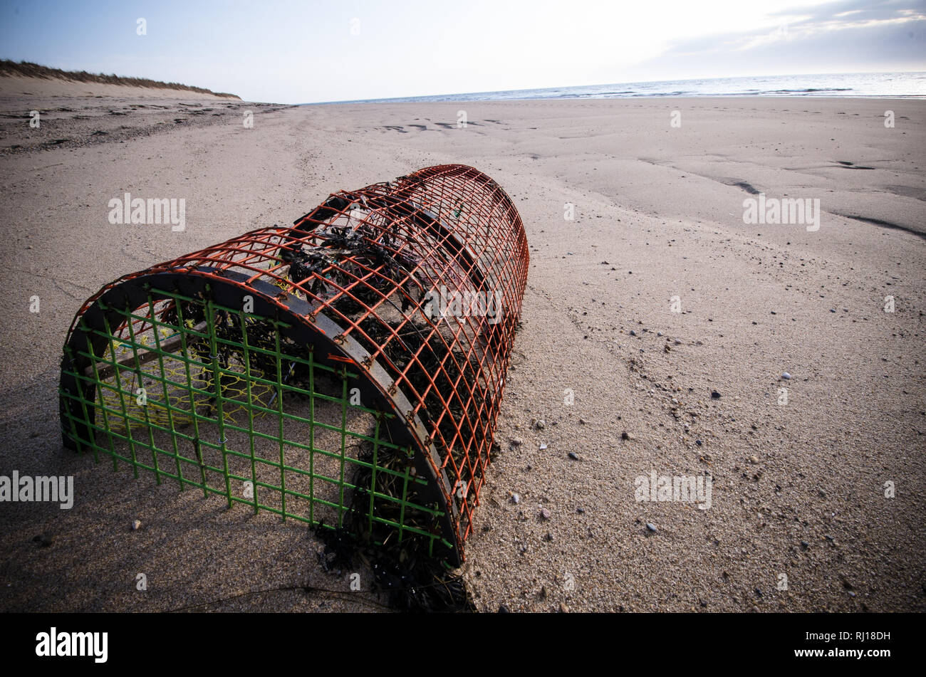 Stack lobster pots on beach hi-res stock photography and images - Alamy