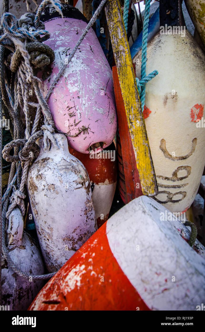 Old weathered bouys attached to a wooden shed on Cape Cod Stock Photo ...