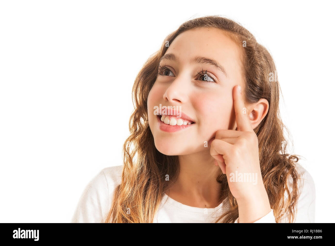Beautiful young girl thinking or having an idea isolated on white ...