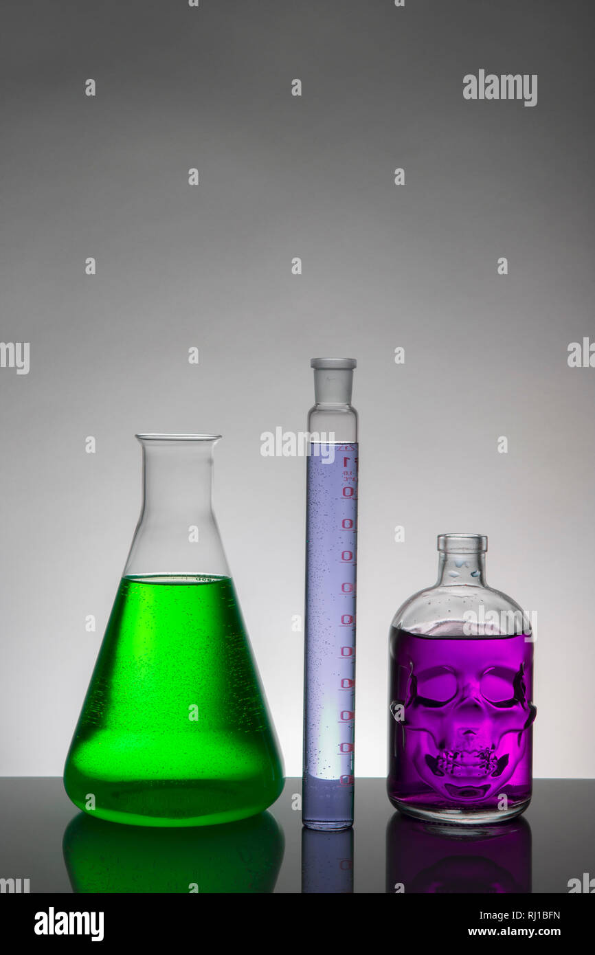 Liquid in laboratory bottles. Scientific biochemical laboratory ...