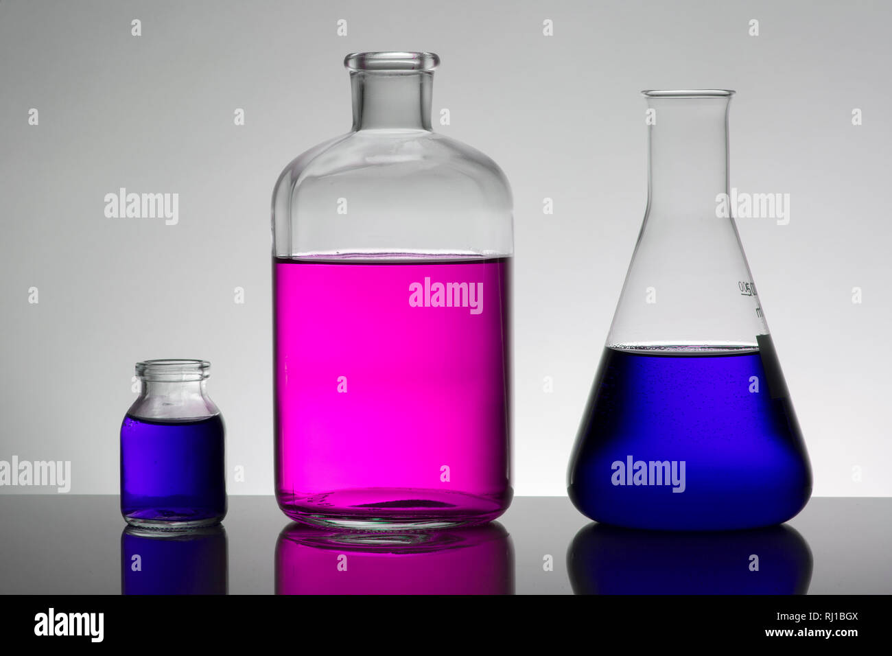 Liquid in laboratory bottles. Scientific biochemical laboratory ...