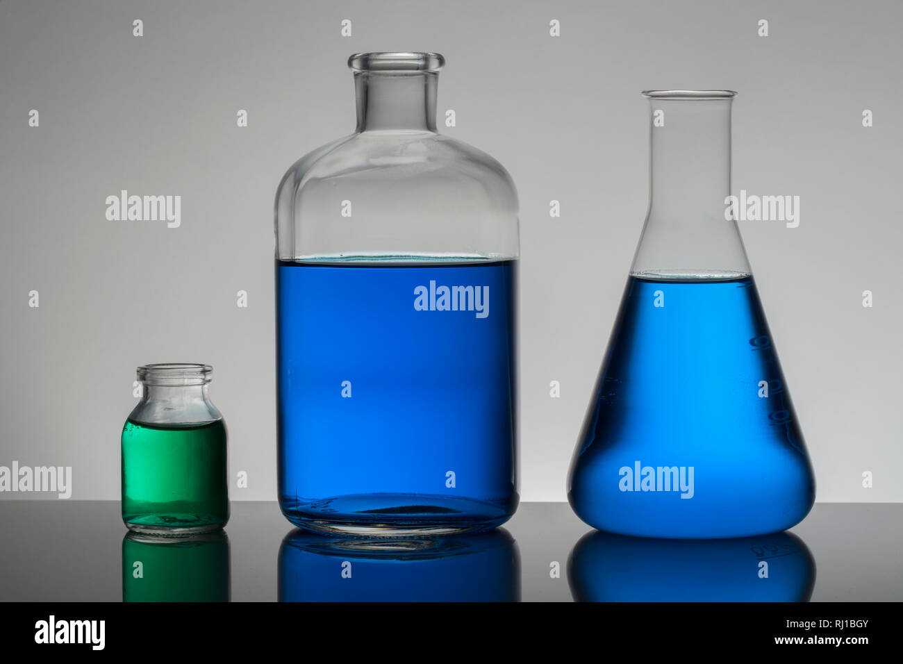 Liquid in laboratory bottles. Scientific biochemical laboratory ...